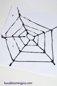 Puffy paint spider web craft - fine motor control for kids