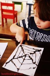 Puffy paint spider web craft - fine motor control for kids